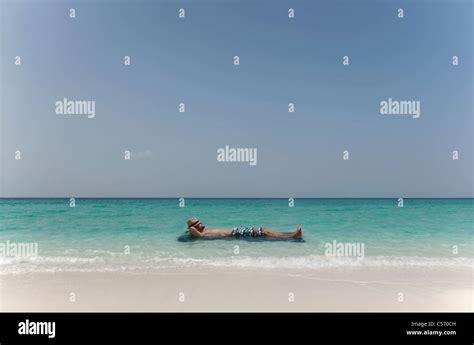 Man Floating In Water At Tropical Beach Stock Photo Alamy