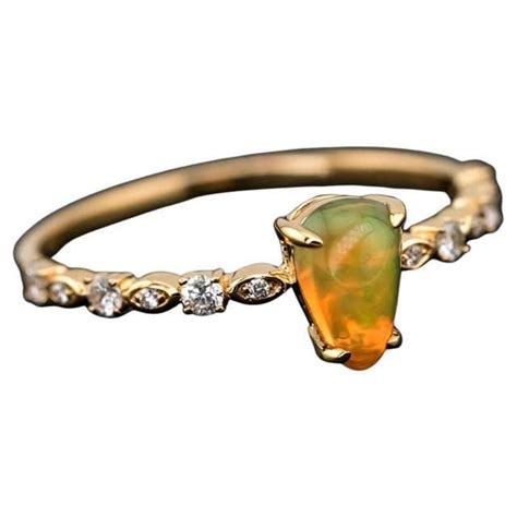 Radiant Halo Mexican Fire Opal Ring With Diamond Accents In 18k Yellow