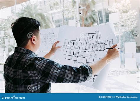 Engineers Are Helping To Design Work On Blueprints And Collaborate On Structural Analyzing Of