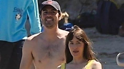 Dakota Johnson Sizzles In Yellow Bikini As She Splashes Around The
