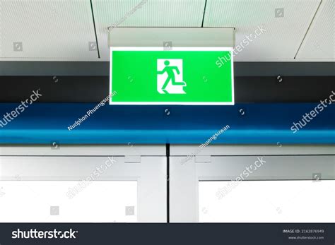 Lighted Glowing Green Emergency Exit Signs Stock Photo 2162876949 Shutterstock