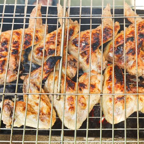 Premium Photo Grilled Chicken Wings On Brazier