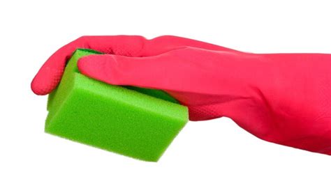 Premium Photo Sponge In Hand Isolated On White