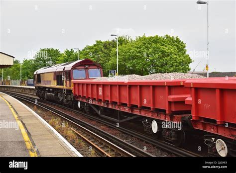 Class 66 No 66031 Brings Up The Rear Of A Ballast Train Passing