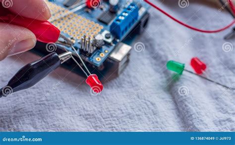 Red And Green LED Lights Being Shown In Use As Part Of A Microcontroller Build Stock Image
