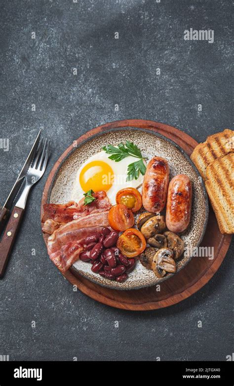 Traditional Full English Breakfast With Fried Eggs Sausages Beans