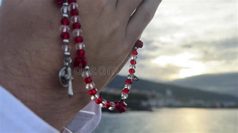 Christian Prayer Man On His Knees Praying On Sunset Background