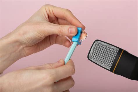 Free Photo Person Sharpening Pencil Close To Microphone For Asmr