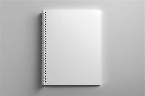 Premium Ai Image A White Notebook Is On A Gray Surface With The Word Notebook On It