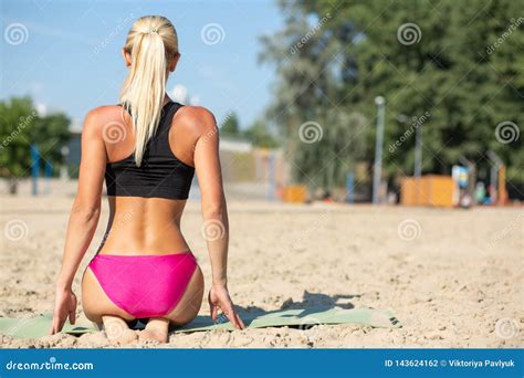 Caucasian Tanned Blonde Woman Practicing Yoga At Beach Space For Text