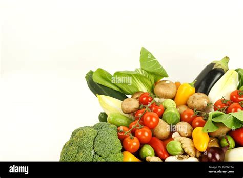 Raw Mixed Organic Vegetables In The Right Bottom Corner Of The Frame