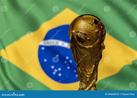 Fifa World Cup Trophy Against The Background Of Brazil Flag Editorial