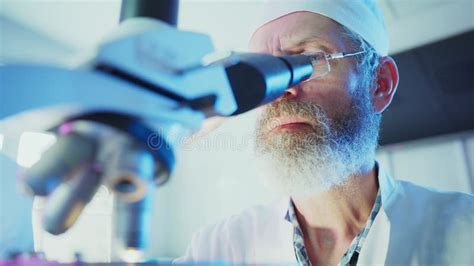 Scientist Analyzing Sample With Microscope In Laboratory Stock Footage Scientist Analyzing Sample With Microscope In Laboratory Stock Footage
