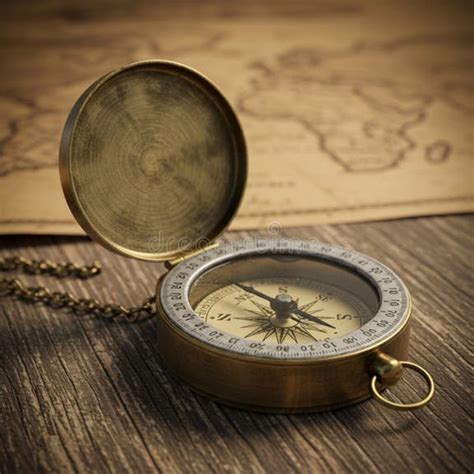 A Vintage Brass Compass With A Lid Featuring A Chain And A Glass Face