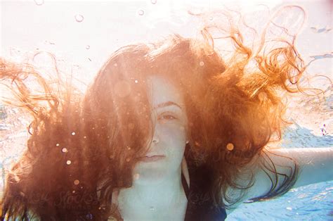 Beautiful Woman Looking Underwater By Stocksy Contributor Boris Jovanovic Stocksy