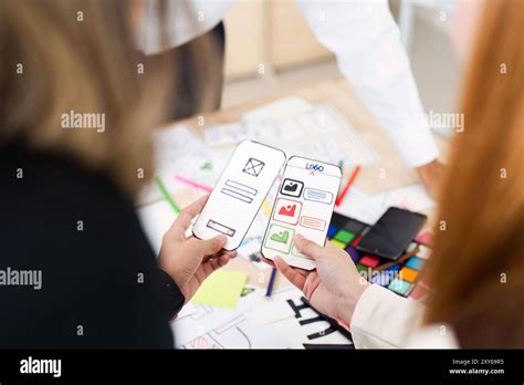 Creative Ux Ui Design Team Collaborating On Mobile App Interface With