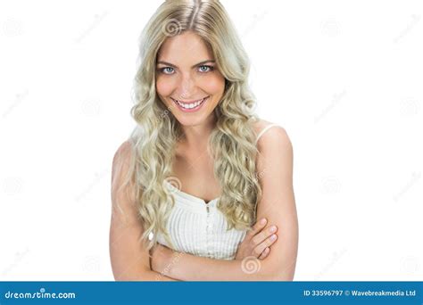 Cheerful Seductive Model In White Dress Posing Crossing Arms Stock