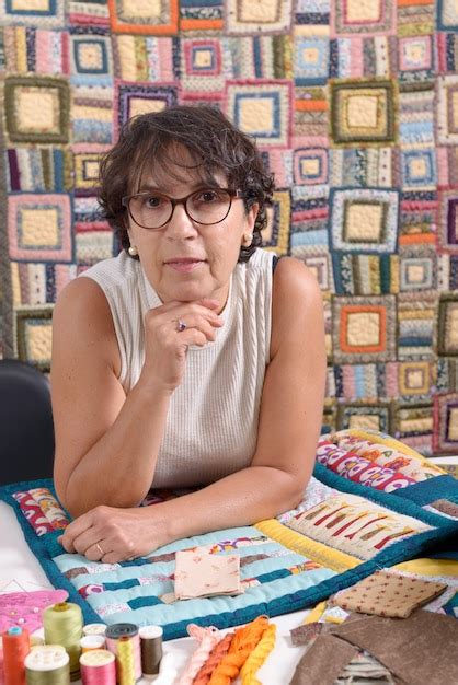 Premium Photo Mature Brunette Woman Sewing Patchwork