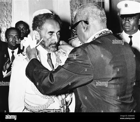 President Francois Duvalier Right Places A Decoration Around The Neck