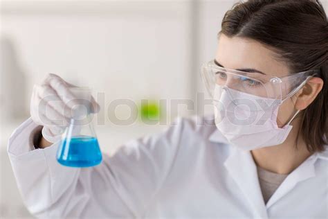 Close Up Of Scientist With Flask Making Test Stock Image Colourbox