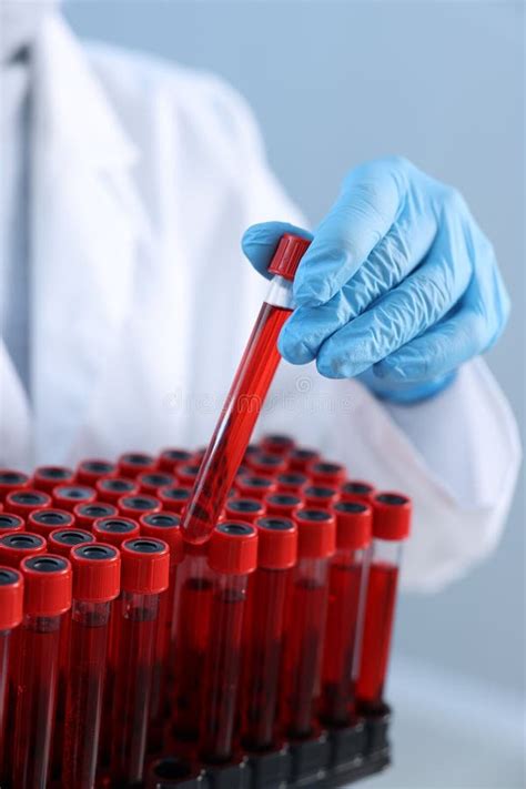 Laboratory Testing Doctor With Blood Samples In Tubes Indoors Closeup