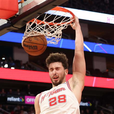 Download Basketball Player Dunking Action Wallpaper