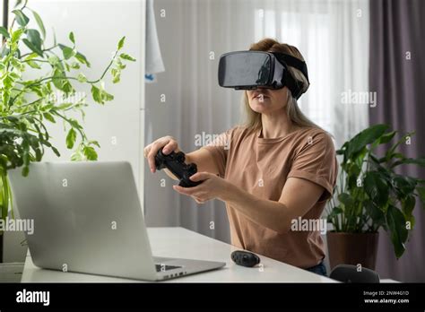 Woman In Vr Headset Looking Up At The Objects In Virtual Reality Vr Is