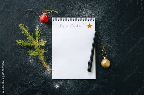 White Page Of Notepad With Inscription Dear Santa Fir Tree Branch