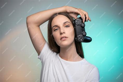 Premium Photo Beautiful Woman Holding Console Controller On Colorful