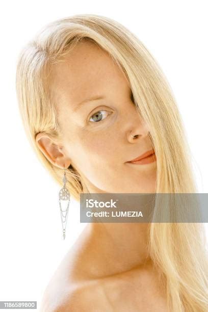 Close Up Profile Portrait Of An Attractive Woman With Straight Blonde