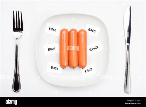 Unhealthy Food Concept Chemical Additives In Food Sausages On Plate