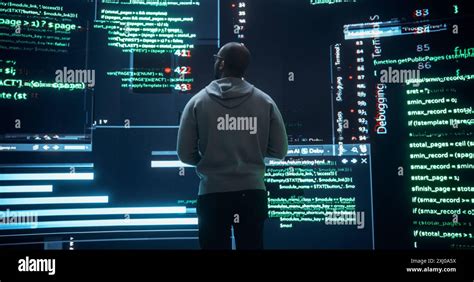 Back View Of Young Black Man Looking At Big Digital Screens Glitching