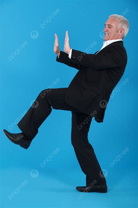 Elderly Man Pushing Object Pose Stretch Background Photo And Picture For Free Download Pngtree
