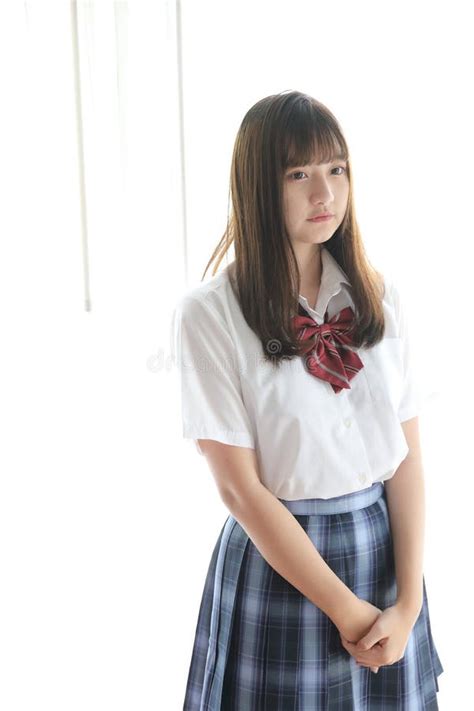 Portrait Japanese School Girl Uniform In White Tone Bed Room Stock
