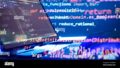 Abstract Software Development Concept With Code And Laptop On Blurred