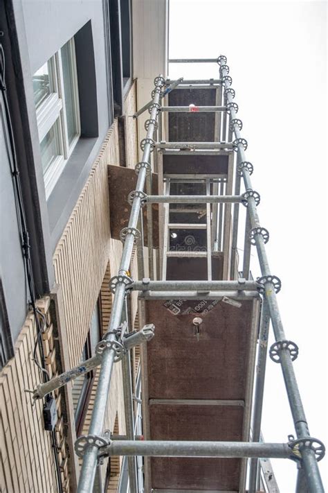 Construction Of Steel Scaffolding Near Building For Renovation Work