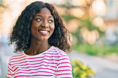 Young African American Girl Smiling Happy Standing At The City Stock