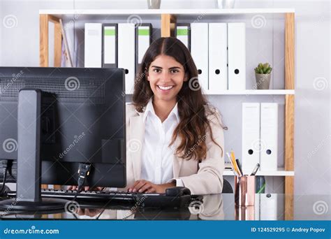Smiling Businesswoman Typing On Keyboard Stock Image Image Of