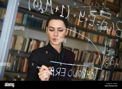 Female Computer Coder Writing Down A Complex Code On A Window At Her Office Female Empowerment