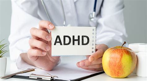 Hand Holding White Notebook Paper With The Text Adhd Awareness Month Stock Image Image Of