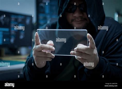 Hacker Using Blank Clear Glass Tablet With Blue Dark And Grain Process