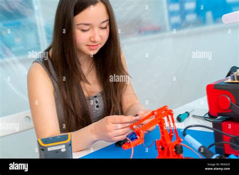 Girl Babegirl In The Classroom In The Laboratory Of Robotics And Electronics Stock Photo Alamy