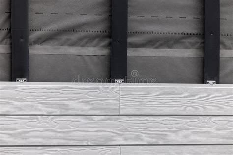 Wood Texture Composite Cladding Installation On House Facade Wpc