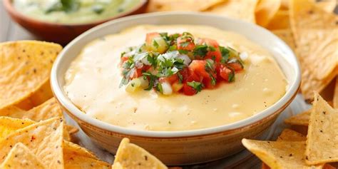 Delicious Queso Dip With Fresh Salsa On Tortilla Chips Concept Texmex