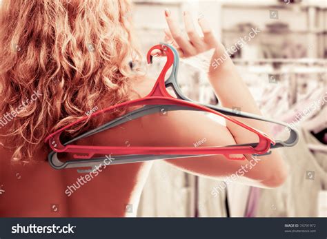 Naked Woman Two Empty Clothes Hangers Foto Stok Shutterstock