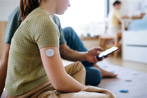 Diabetic Girl With A Cgm Sensor On Her Arm Stock Image Image Of Technology Monitoring 371567875
