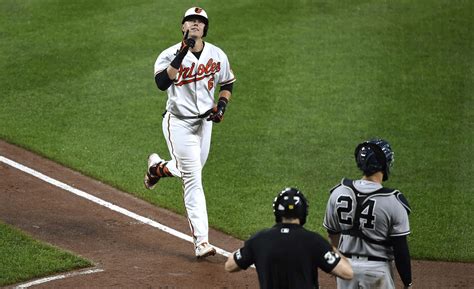 Download Orioles Player Celebrating Hit Wallpaper