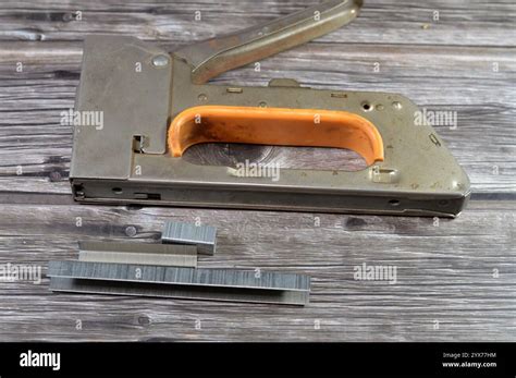 Manual Staple Gun Powered Stapler Is A Hand Held Machine Used To Drive