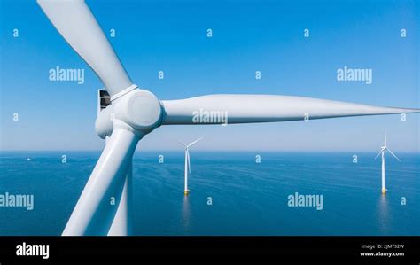 Windmill Park In The Ocean Drone Aerial View Of Windmill Turbines Generating Green Energy