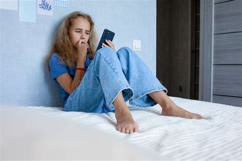 A Cute Teenage Girl Communicates Via Video Communication Via The